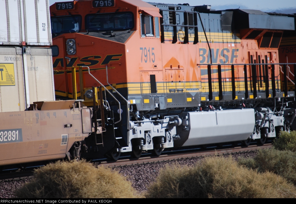 BNSF 7915 close up full view as she rolls past me eastbound.